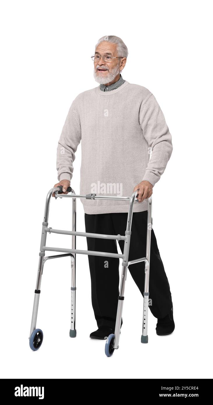 Senior man using walking frame on white background Stock Photo - Alamy