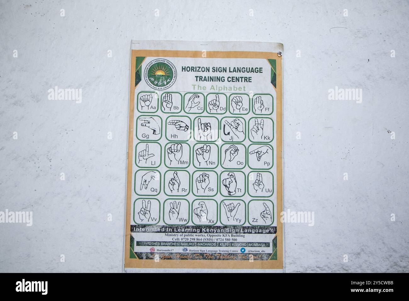 A poster with sign language alphabets is displayed at the Horizon Sign ...