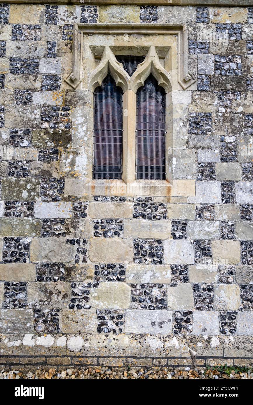 Window and wall of chequered flint and limestone wall, Church of St ...