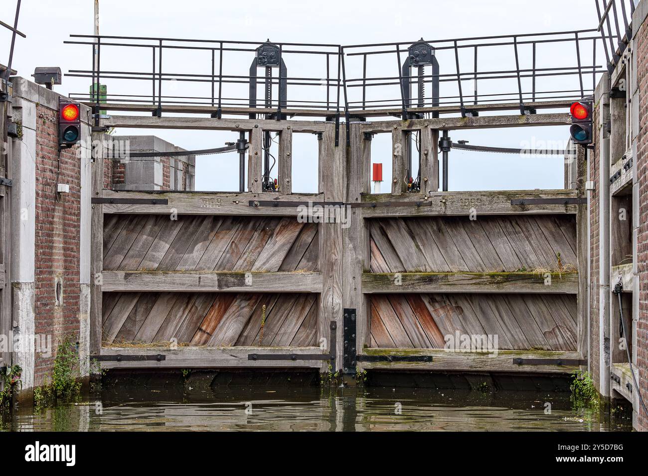 Old wooden gate at entrance or exit of old and historic lock number 20 ...