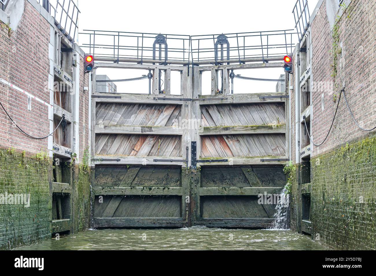 Old and historic lock number 20 with wooden gate at entrance or exit ...