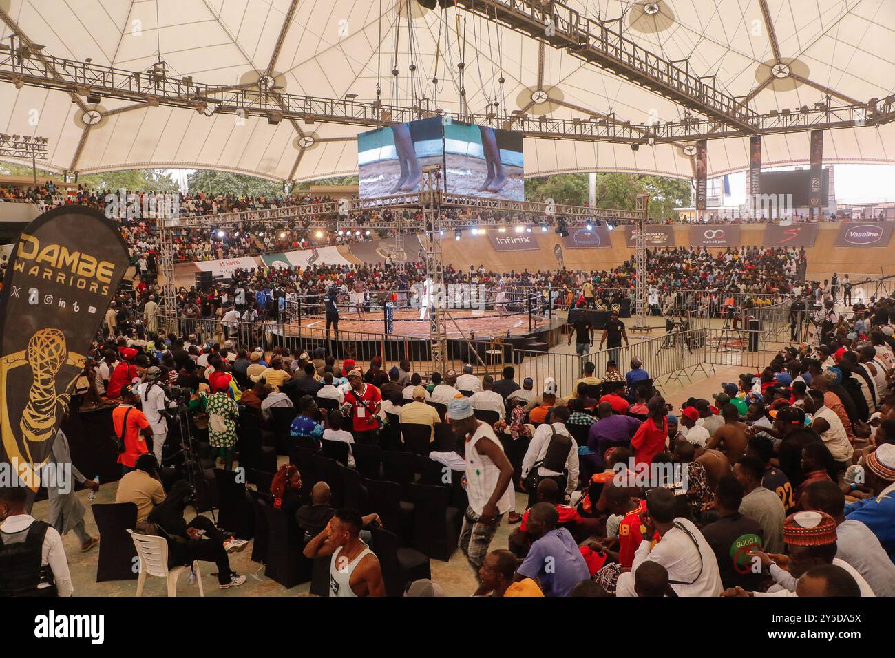 People watch Dambe boxers fight during the Dambe Warriors Supper fight ...