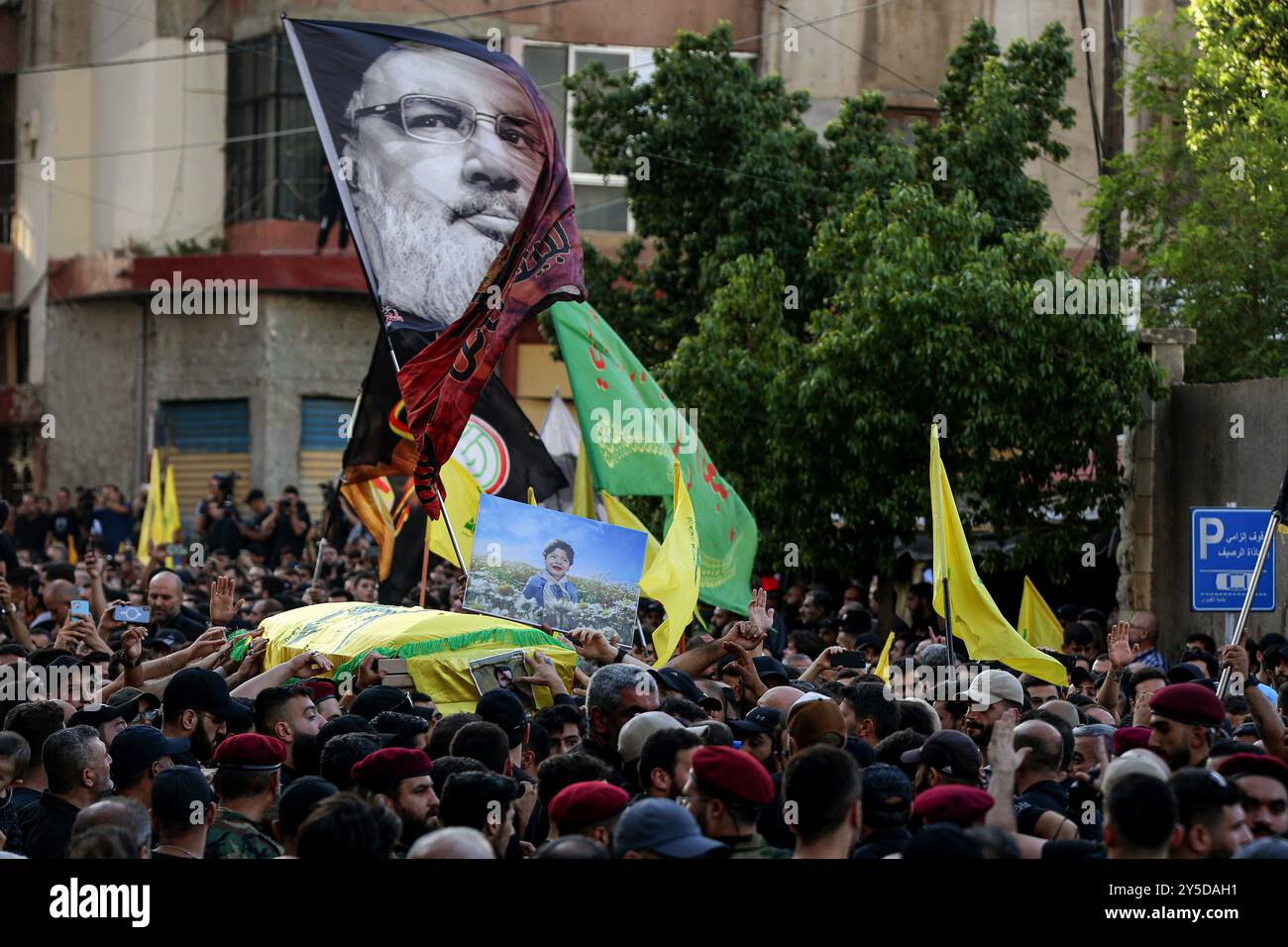Beirut, Lebanon. 21st Sep, 2024. Pro-Iranian Hezbollah supporters carry ...