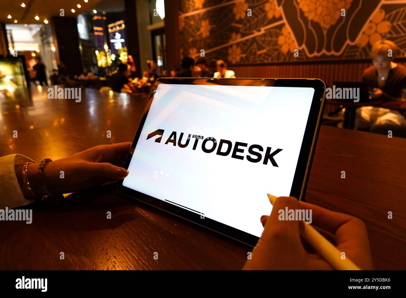 In this photo illustration, an Autodesk logo is displayed on the screen ...