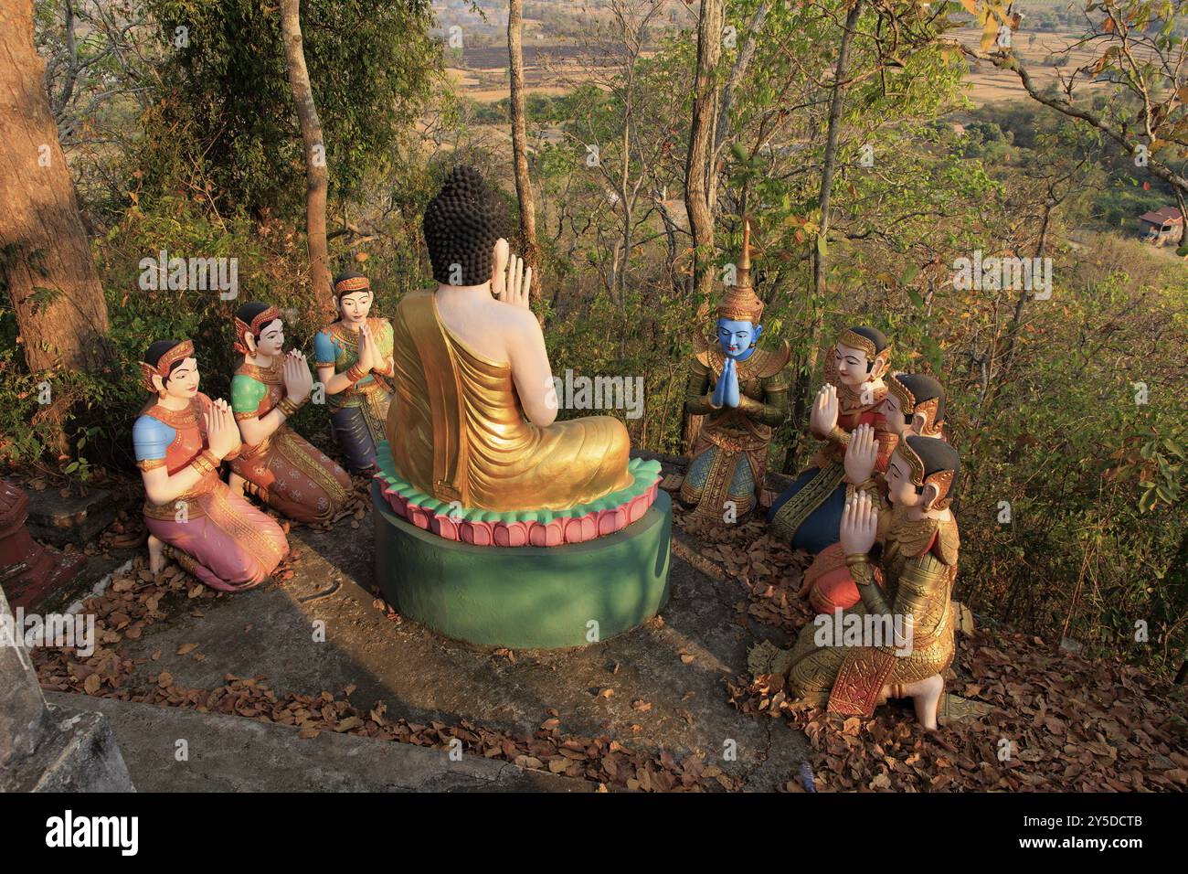 Buddha with a group of praying people in the Phnom Sambok Pagoda near ...