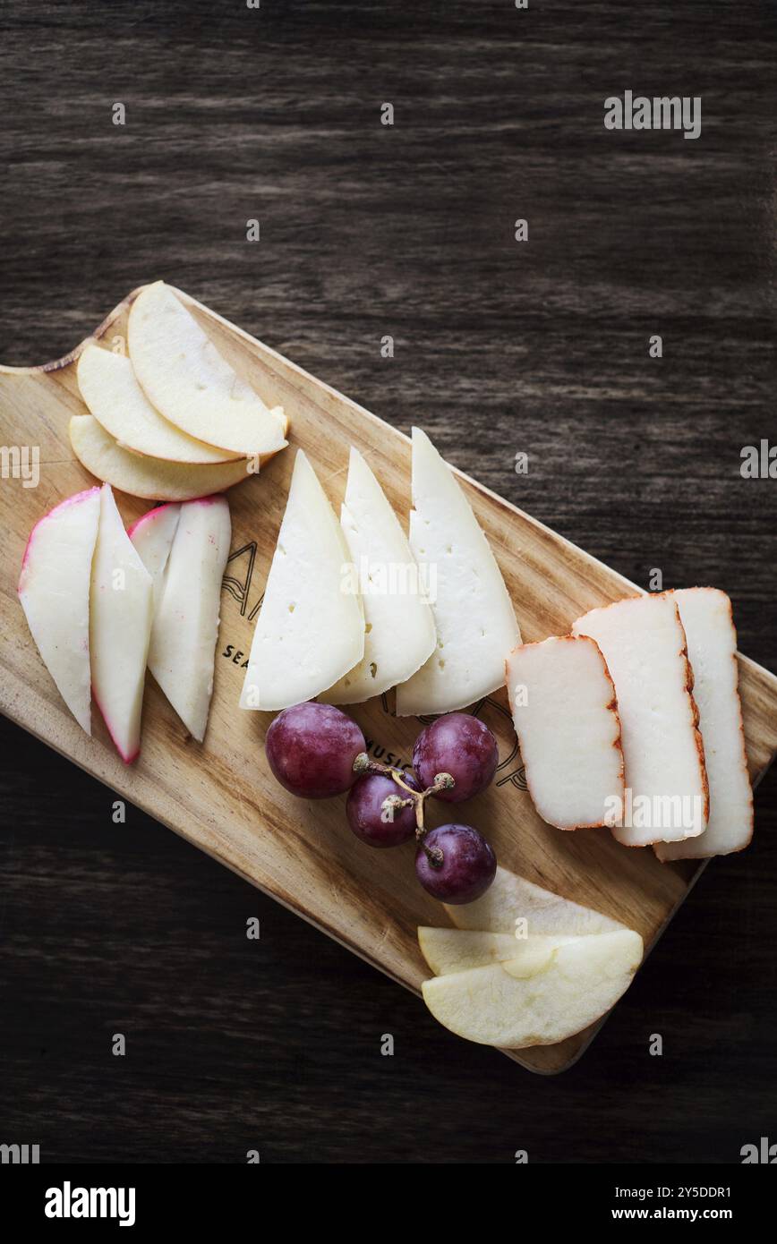 Mixed portuguese cheese tapas snack platter with apple and grapes set ...