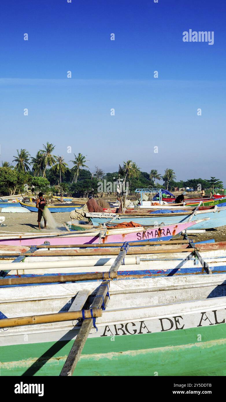 Traditional colourful asian fishing boats on dili beach in east timor ...