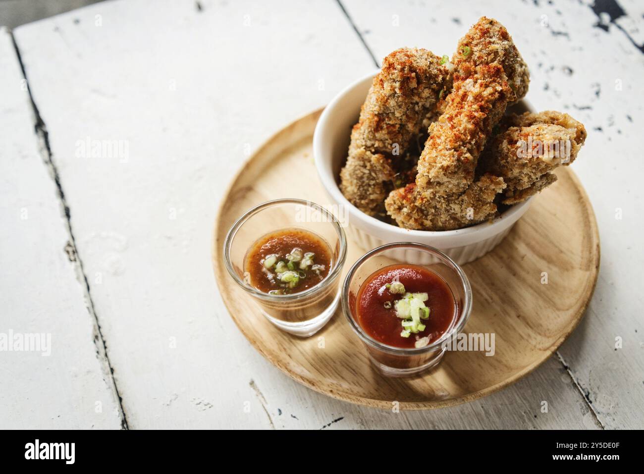 Breaded mozzarella cheese stick finger bites snack food with salsa dips ...