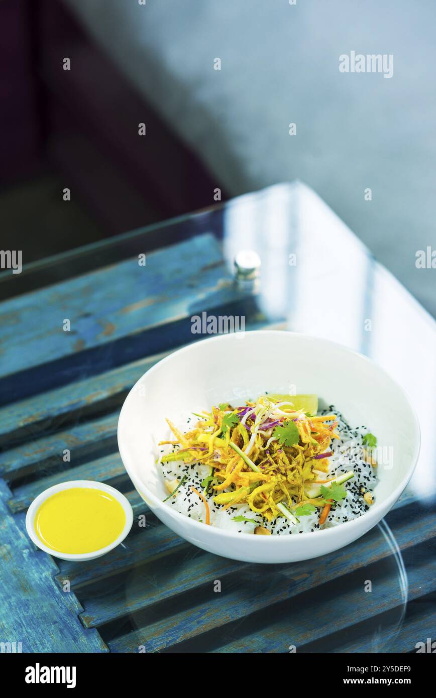 Asian spicy curry vegetable cold rice noodle salad Stock Photo - Alamy