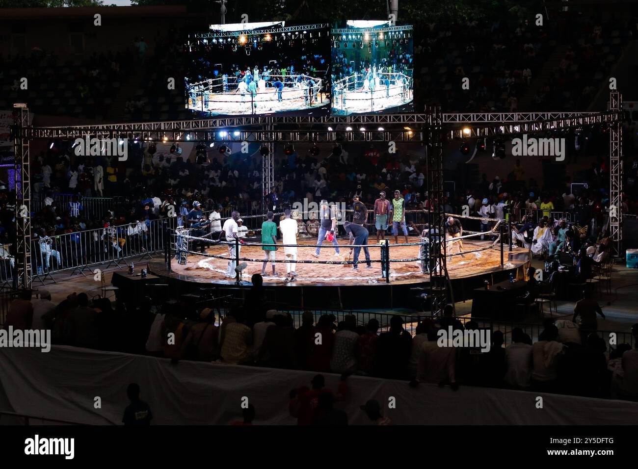 People watch Dambe boxers fight during the Dambe Warriors Supper fight ...