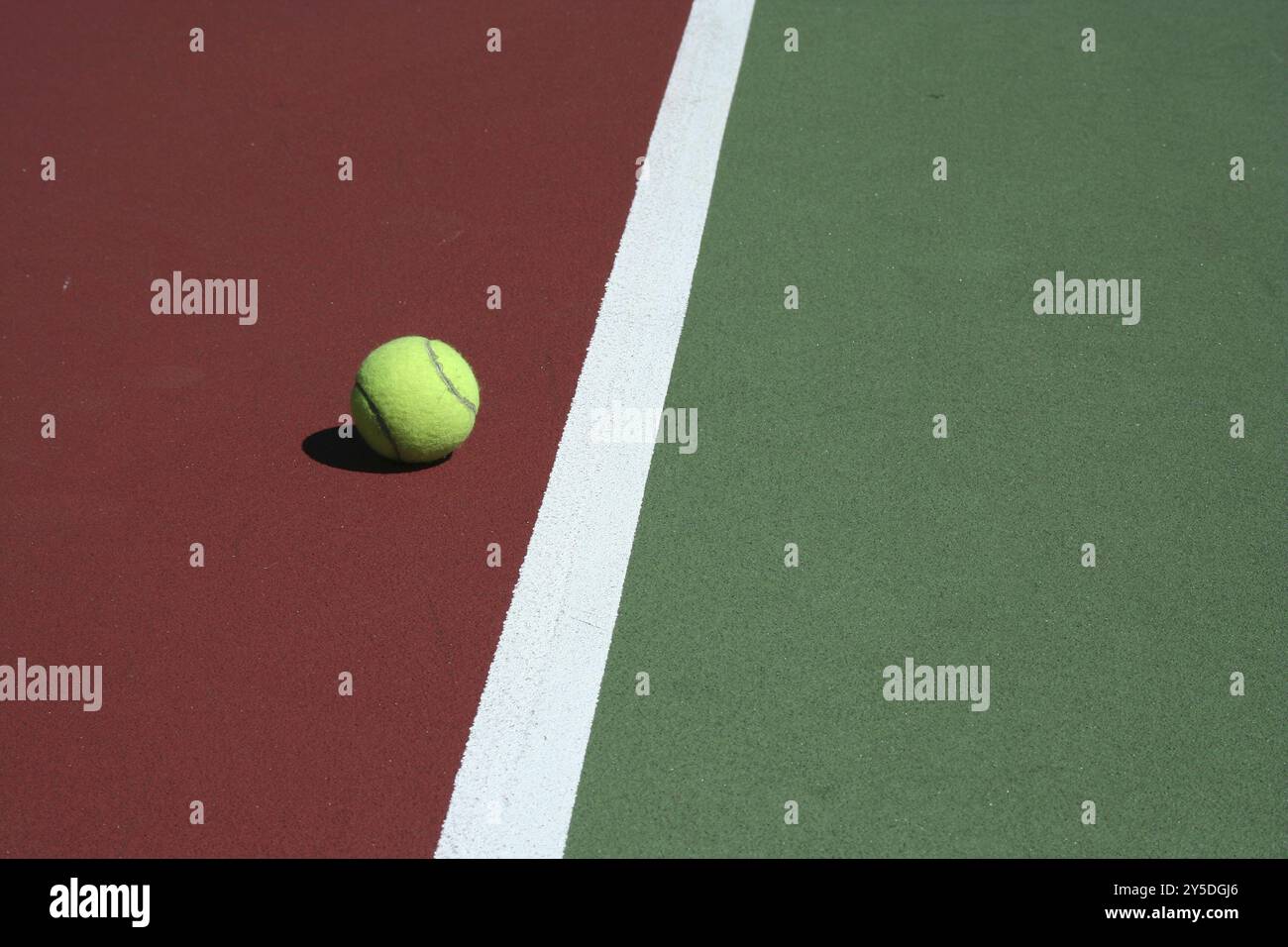 A Tennis Ball out of bounds with white line Stock Photo - Alamy