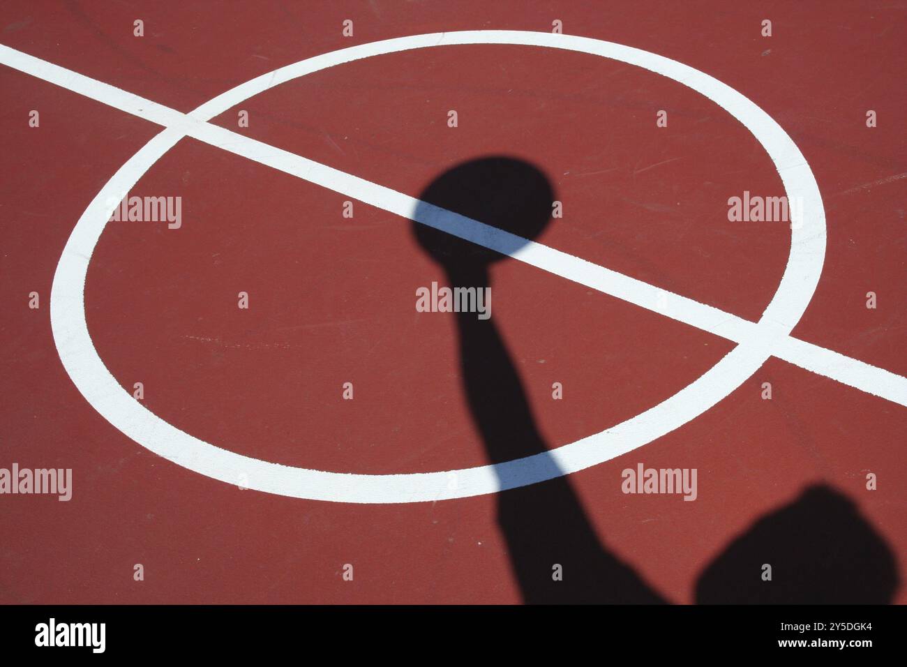 A Shadow Basketball player jump ball on red court Stock Photo - Alamy
