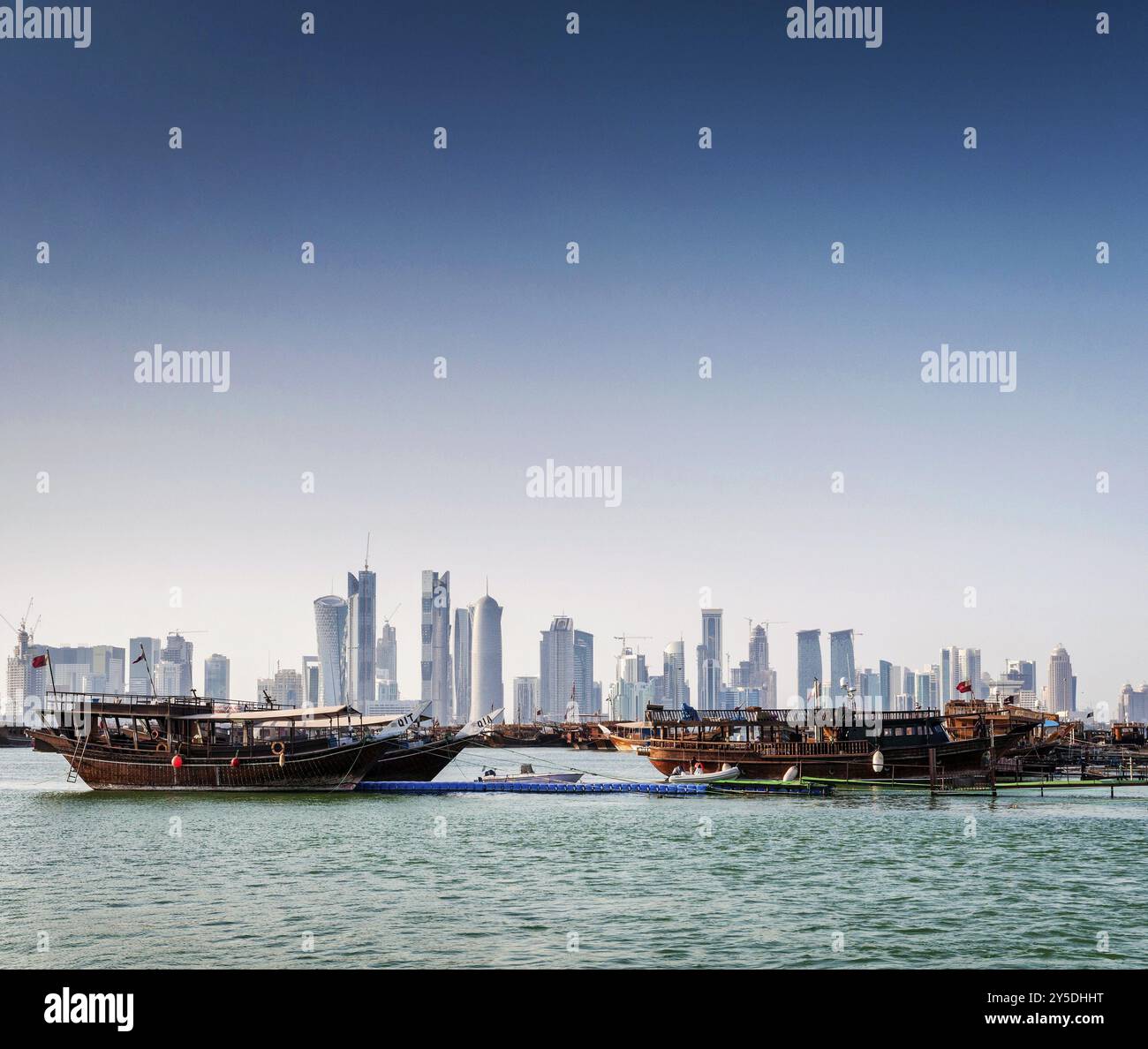 Doha city skyscrapers urban skyline view and dhow boat in qatar Stock ...