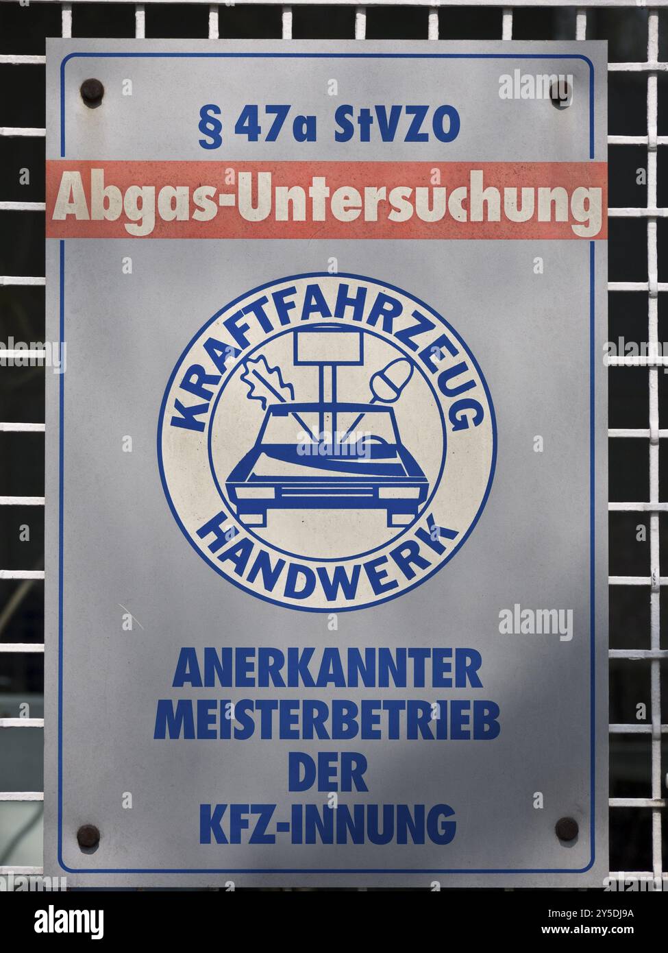 Sign of a car workshop for exhaust gas testing Stock Photo - Alamy