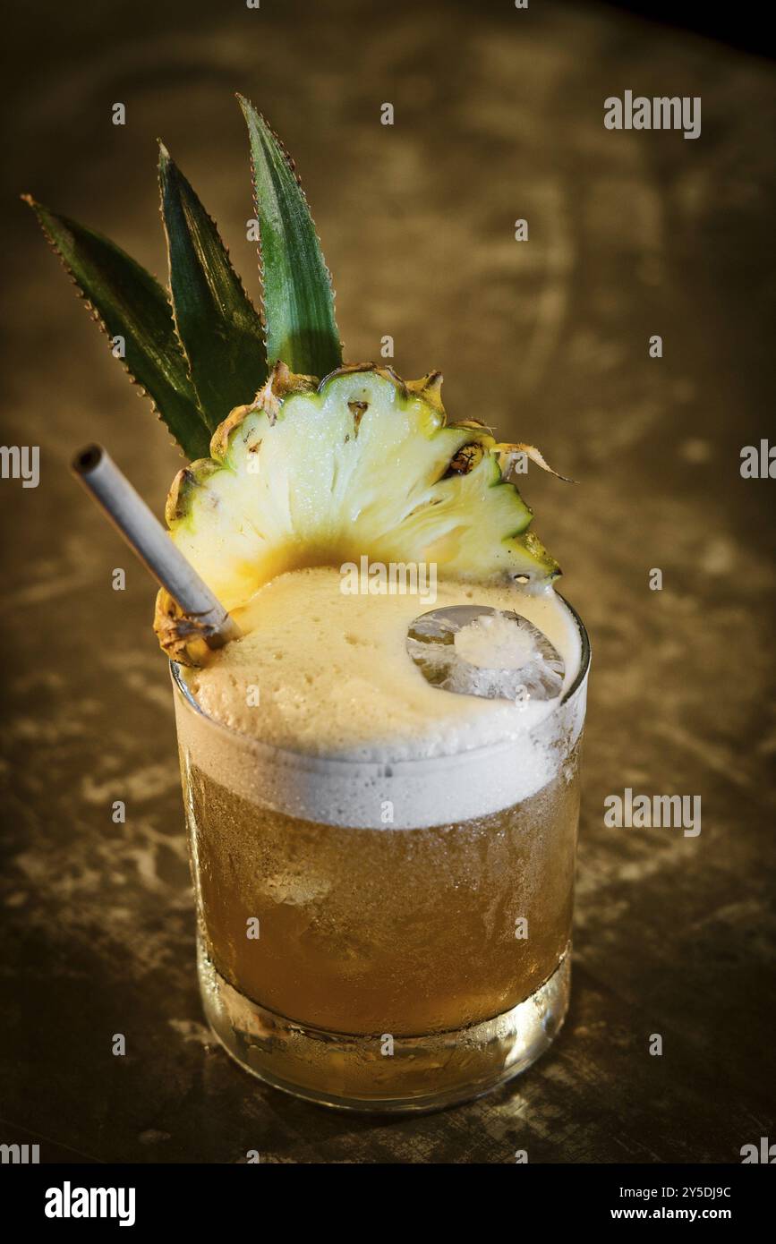 Pineapple mango tropical rum fruity cocktail drink in bar Stock Photo ...
