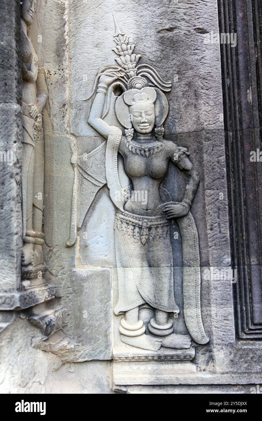 Apsara half-human, half-divine woman of Hinduism and Buddhism in the temple of Ta Prohm in ...