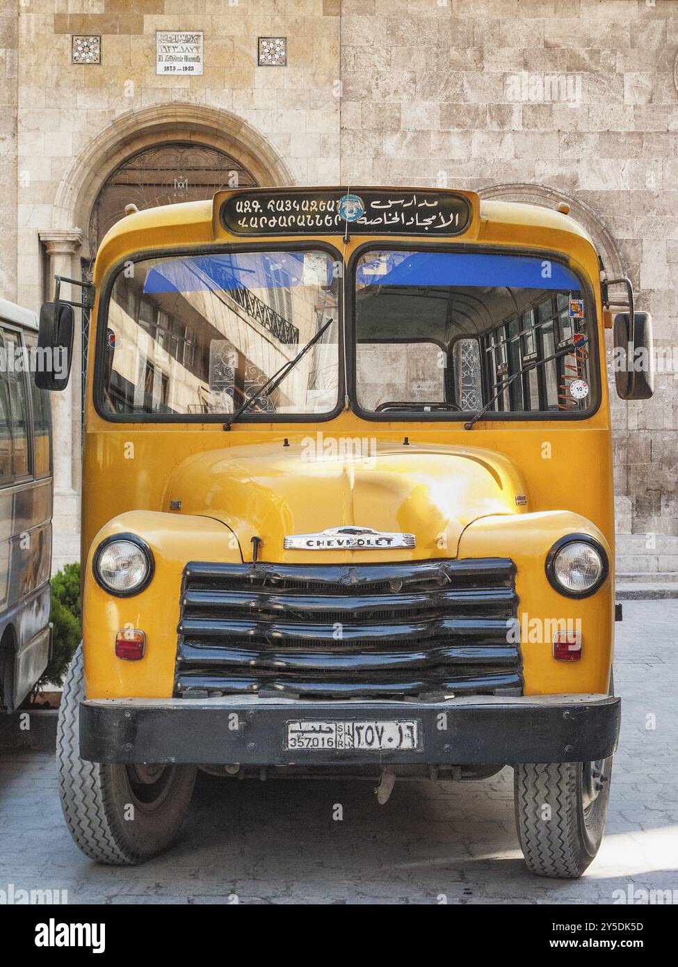 Vintage armenian school yellow chevrolet bus in aleppo old town syria ...