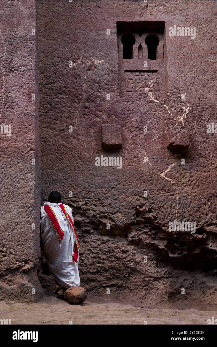 Priest praying outside church in lalibela ethiopia Stock Photo - Alamy