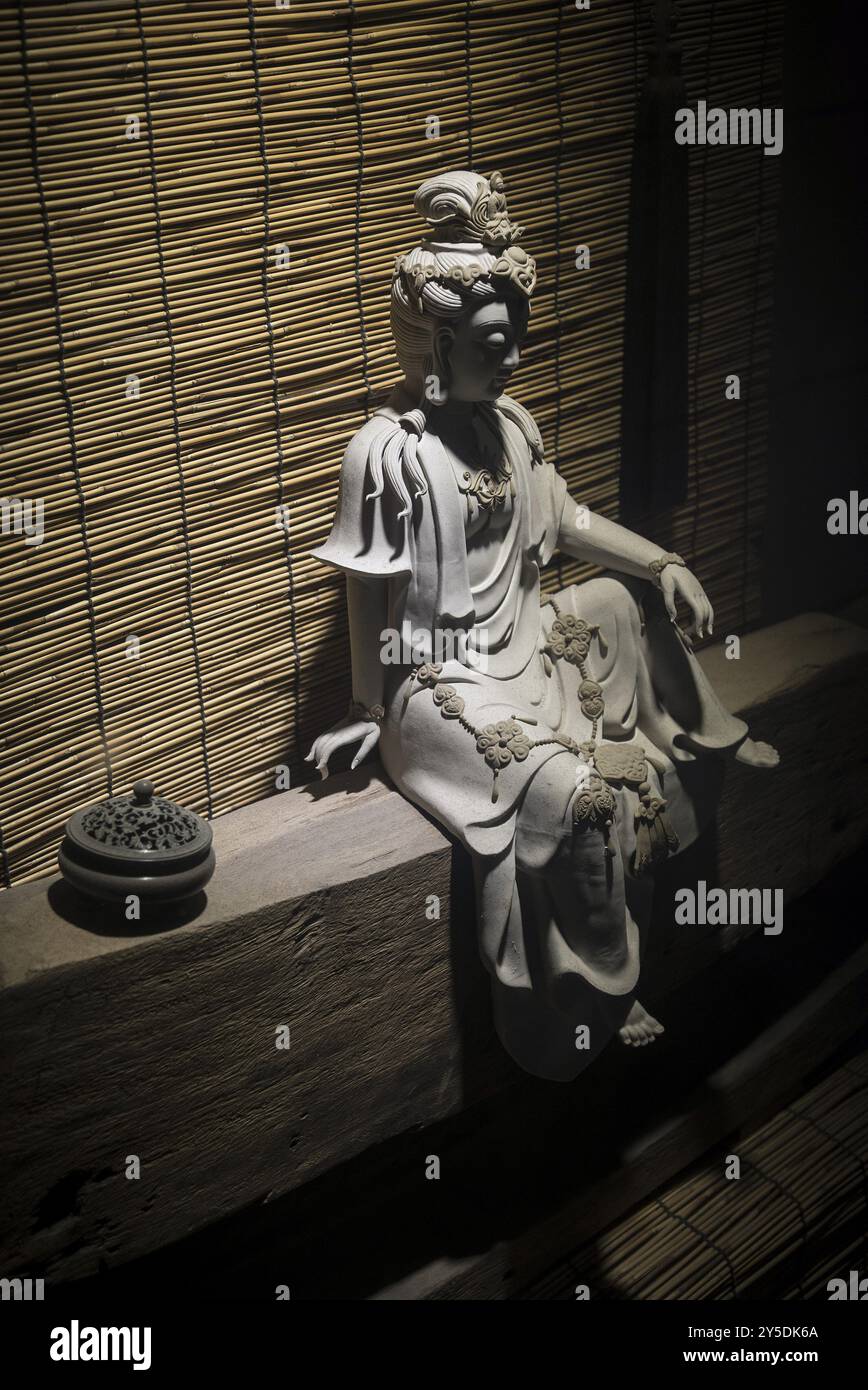 Chinese traditional white stone statue sculpture on display under ...