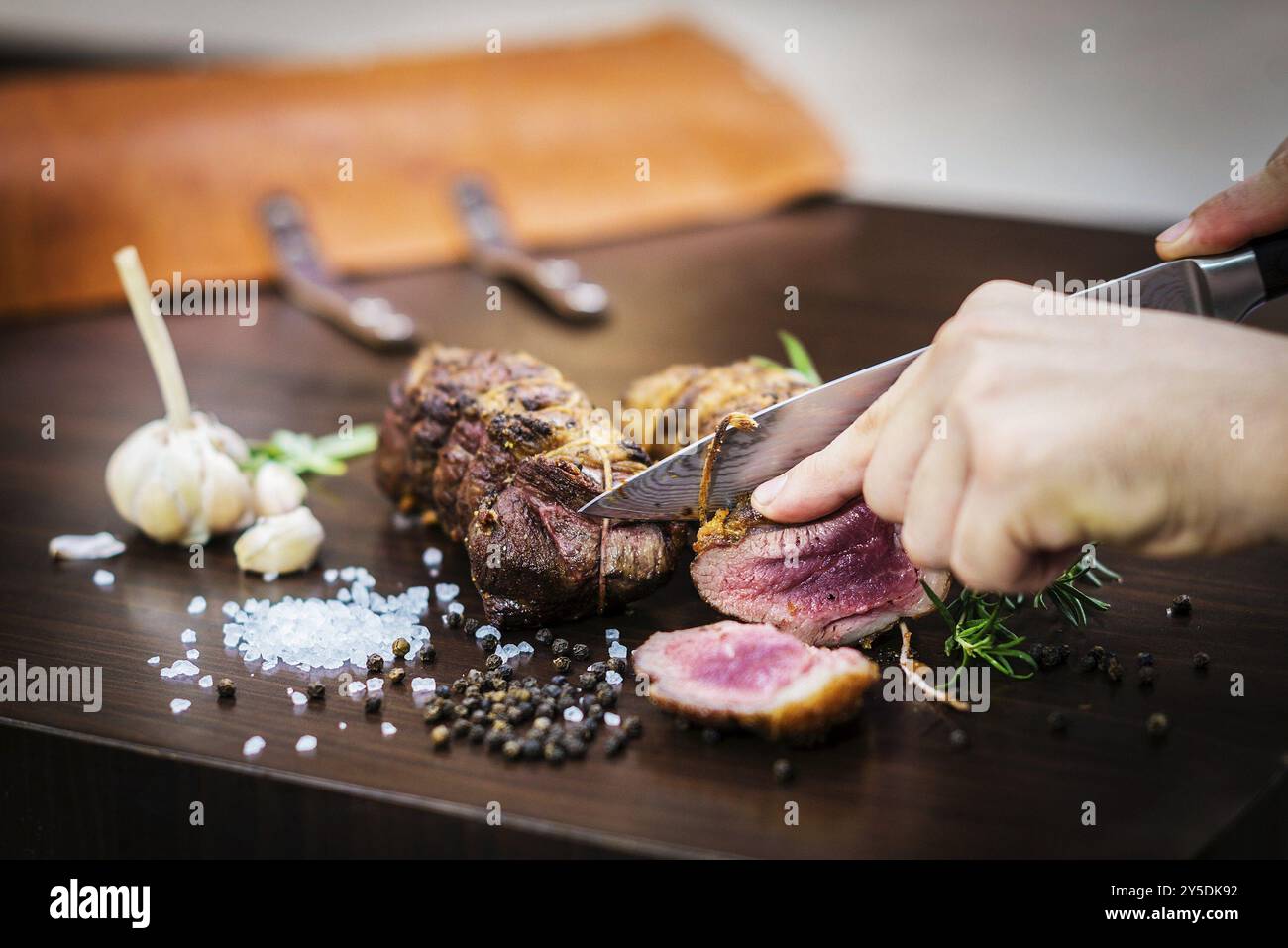 Serving carving roast pork meat roll meal in rustic style with ...