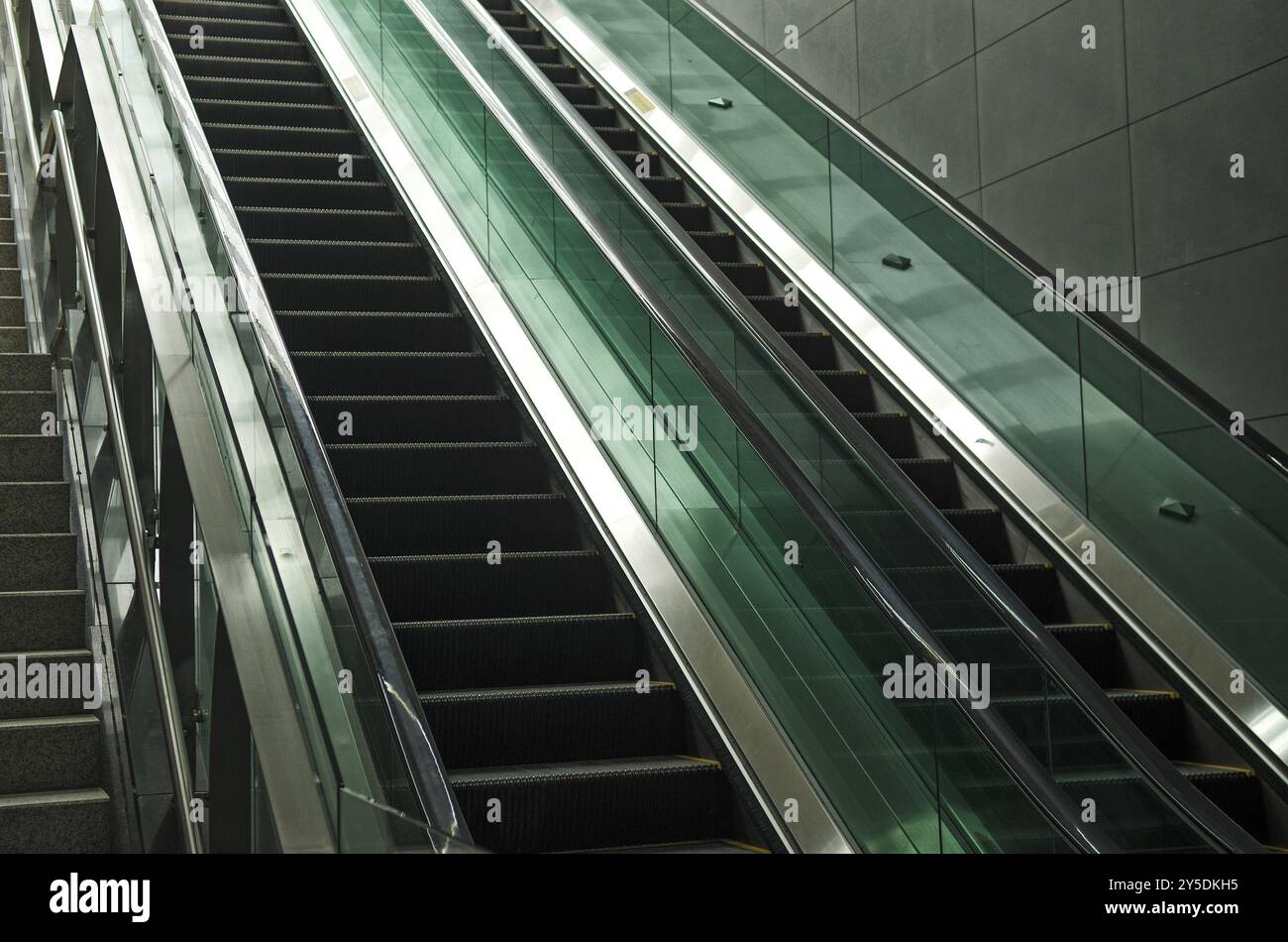 Detail of modern glass and metal escalator Stock Photo - Alamy