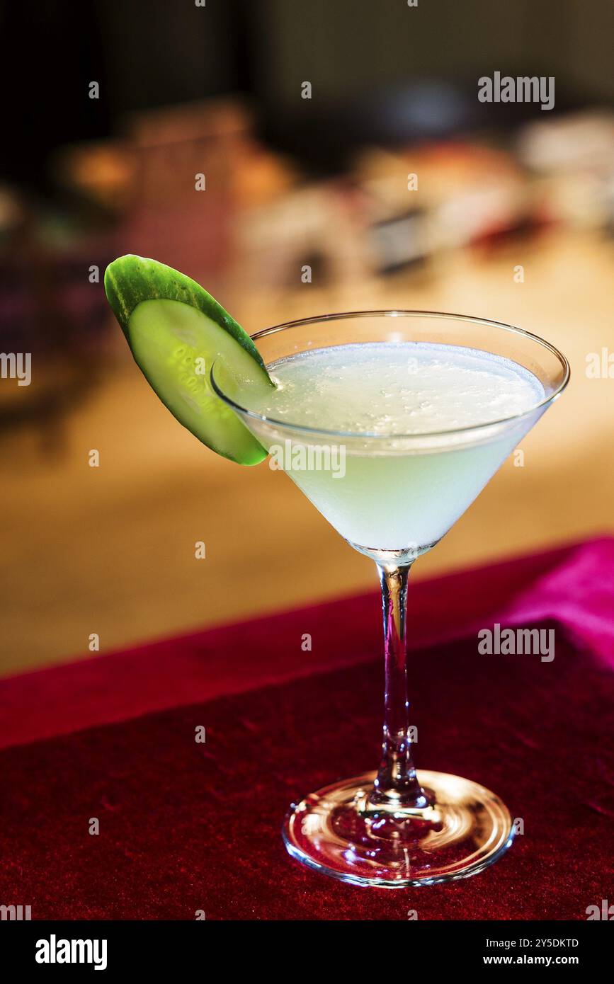 Modern blue martini cocktail with lime in bar Stock Photo - Alamy
