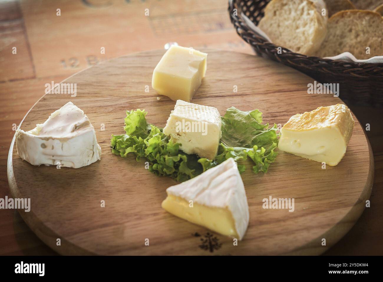 Mixed traditional french cheese platter with bread Stock Photo - Alamy
