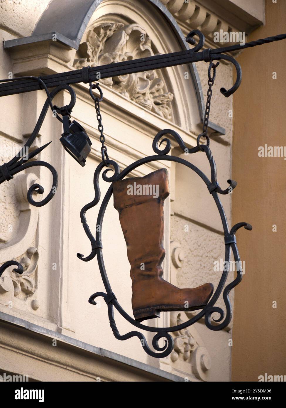 Wrought iron shop sign for a cobbler's shop Stock Photo - Alamy