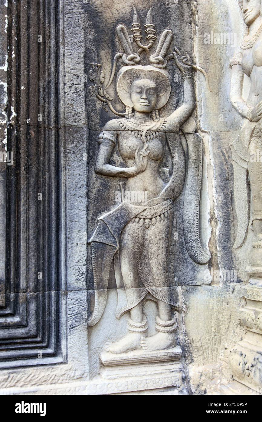 Apsara half-human, half-divine woman of Hinduism and Buddhism in the temple of Ta Prohm in ...