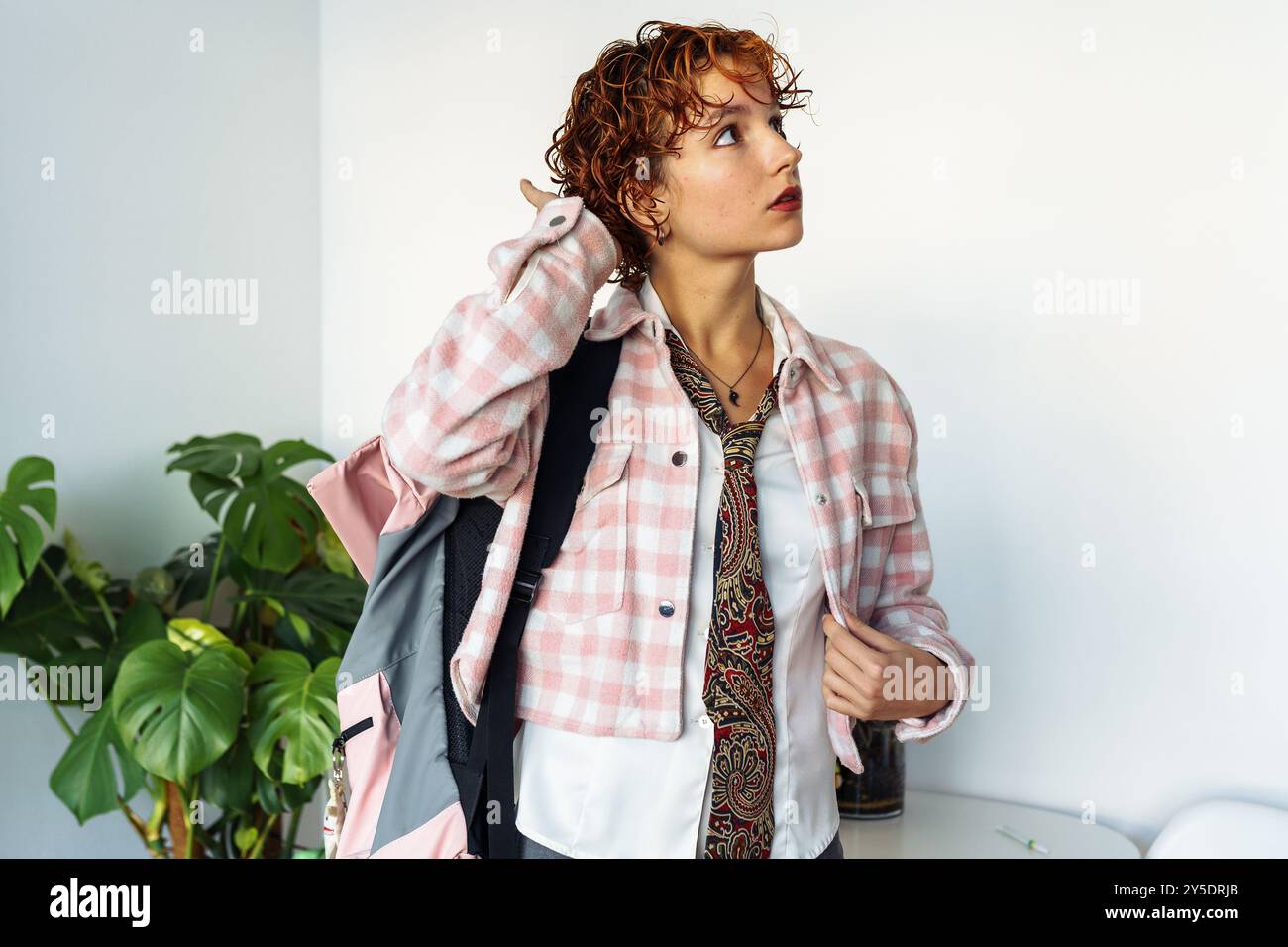 attractive extravagantly dressed young woman, student, schoolgirl with ...