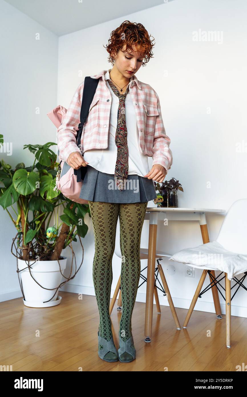 attractive extravagantly dressed young woman, student, schoolgirl with ...