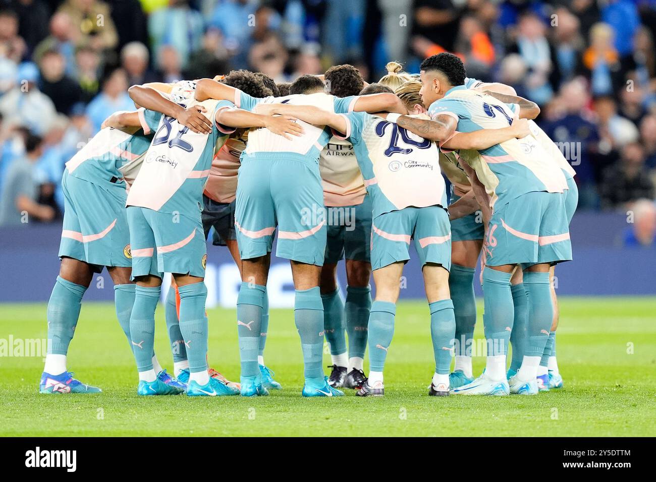 Manchester City players form a huddle ahead of the UEFA Champions ...