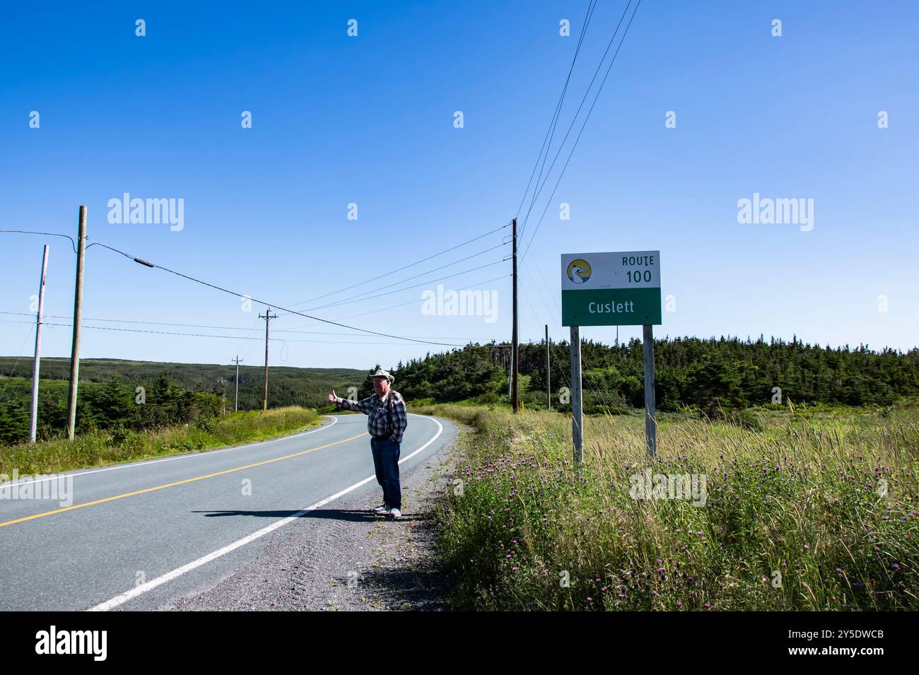 Hitchhiking by the route 100 sign in Cuslett, Newfoundland & Labrador ...
