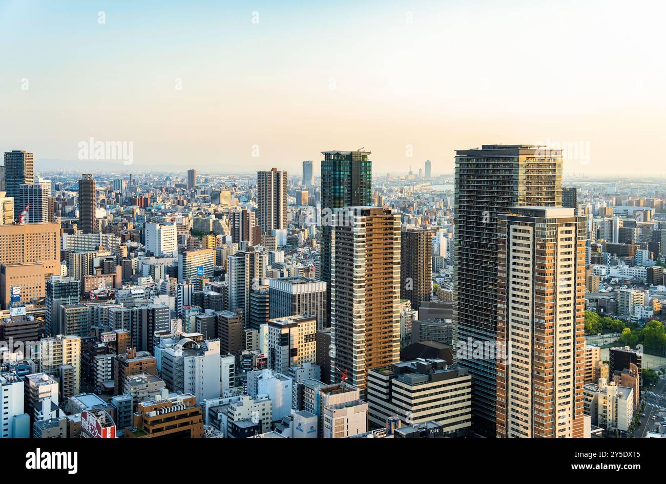 Aerial scenic view of Osaka skyline at sunset. Modern glass skyscrapers ...