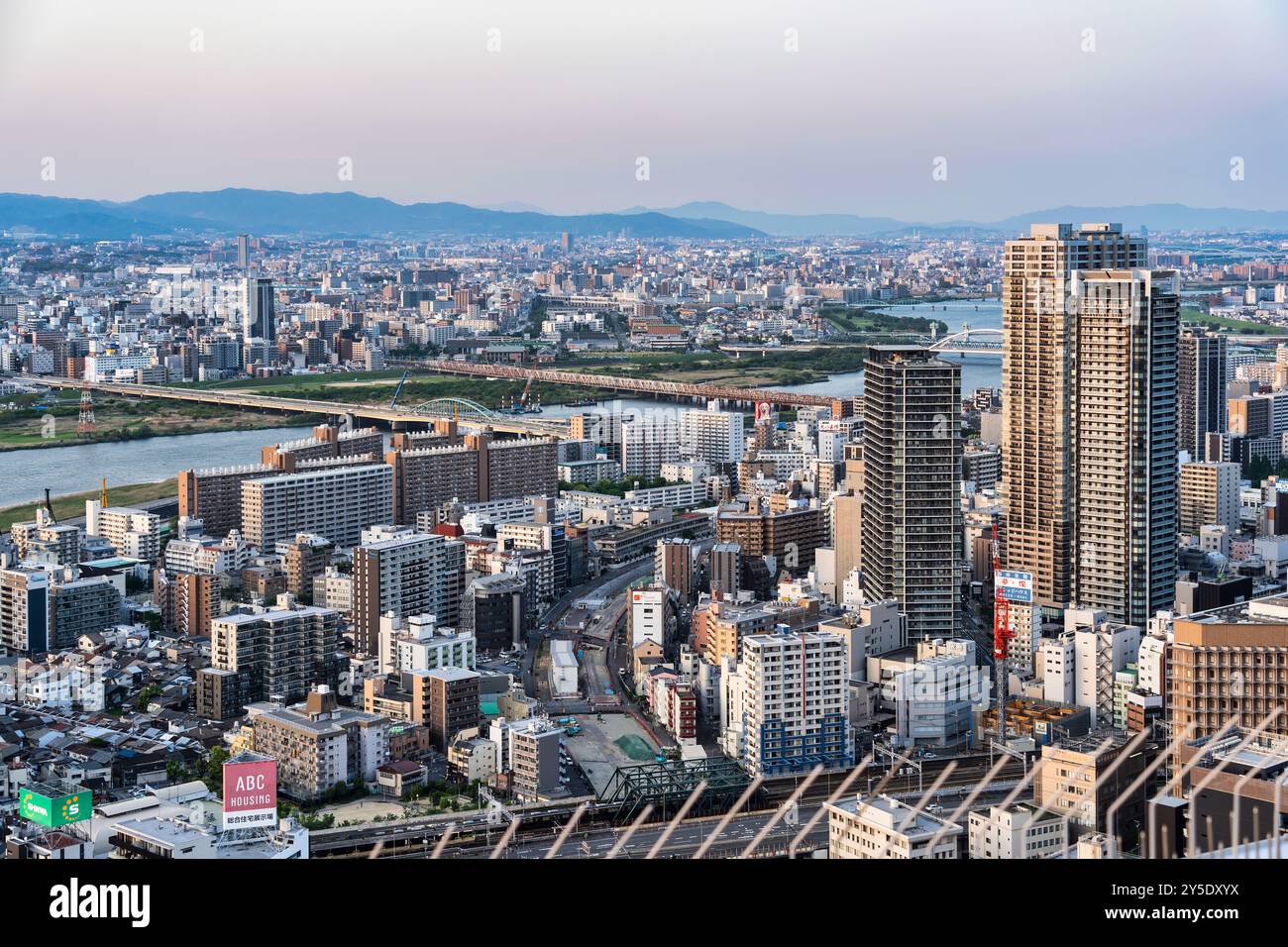 Aerial scenic view of Osaka skyline at sunset. Modern glass skyscrapers ...