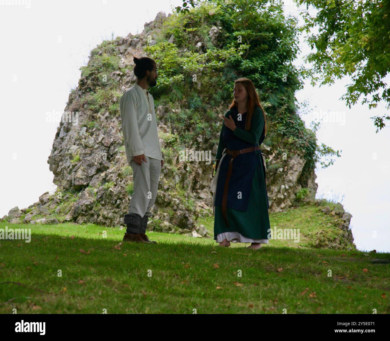 A young couple, deep in discussion, at the Medieval Artisans Market ...