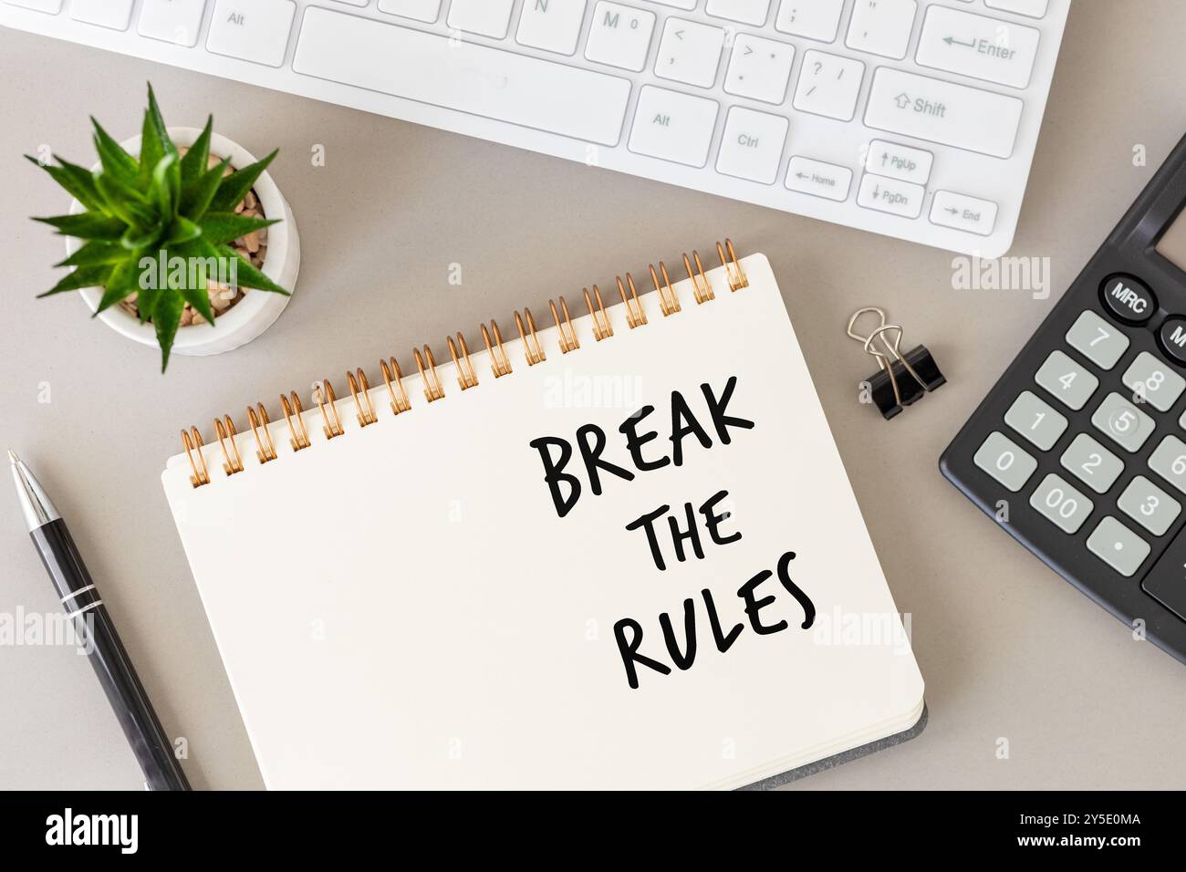 break the rule written in a notebook lying on a desk at work. Business ...