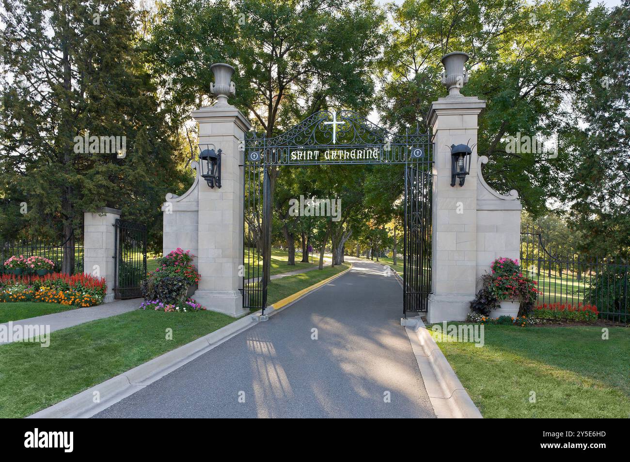 Sun shining through front Gates of St. Catherine University with lots ...