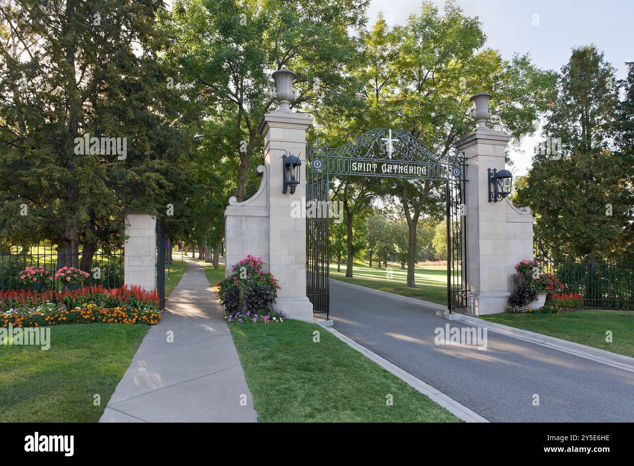 Sun shining through front Gates of St. Catherine University with lots ...