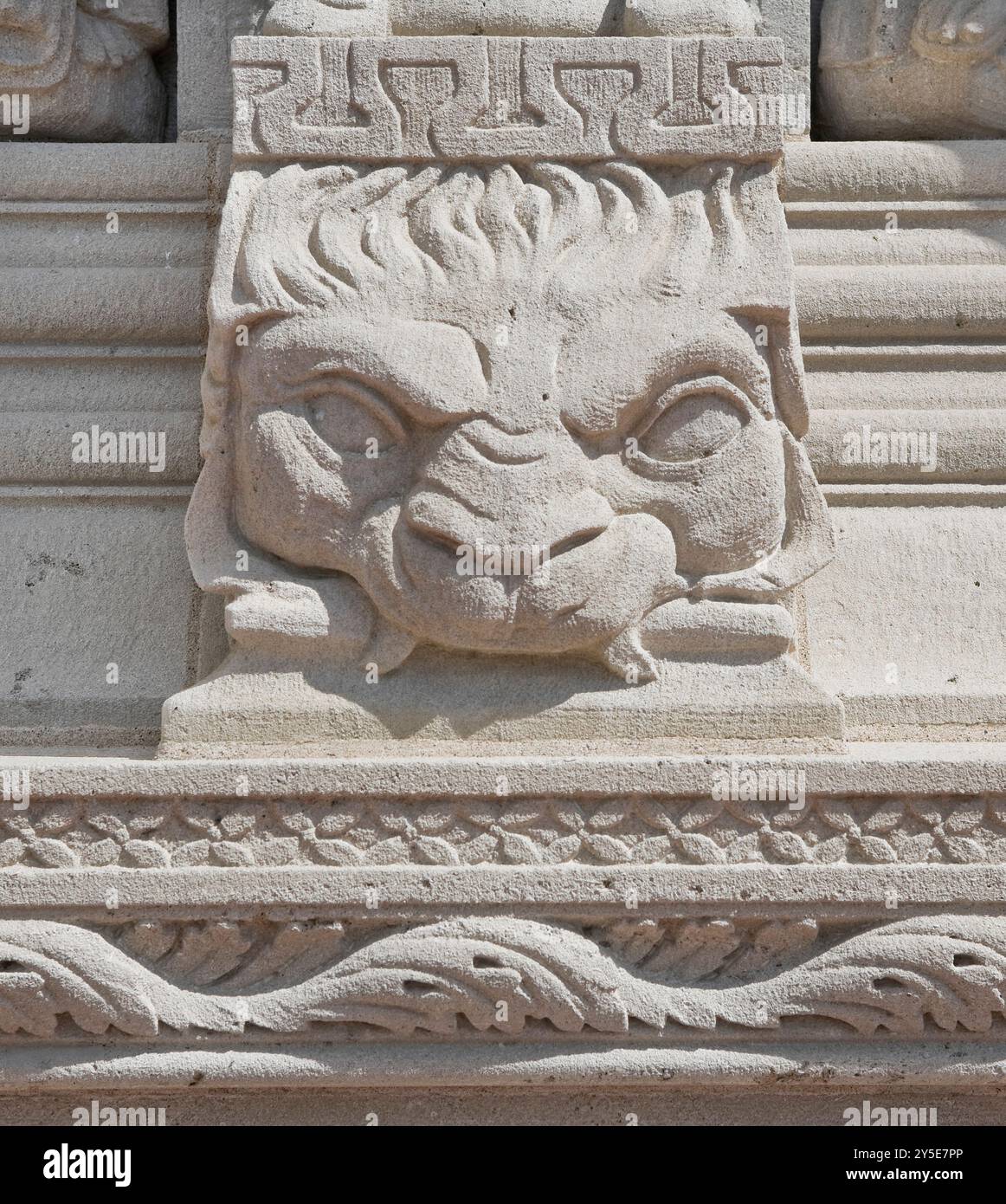 Detail showing carving of beast at base of column on exterior of church ...