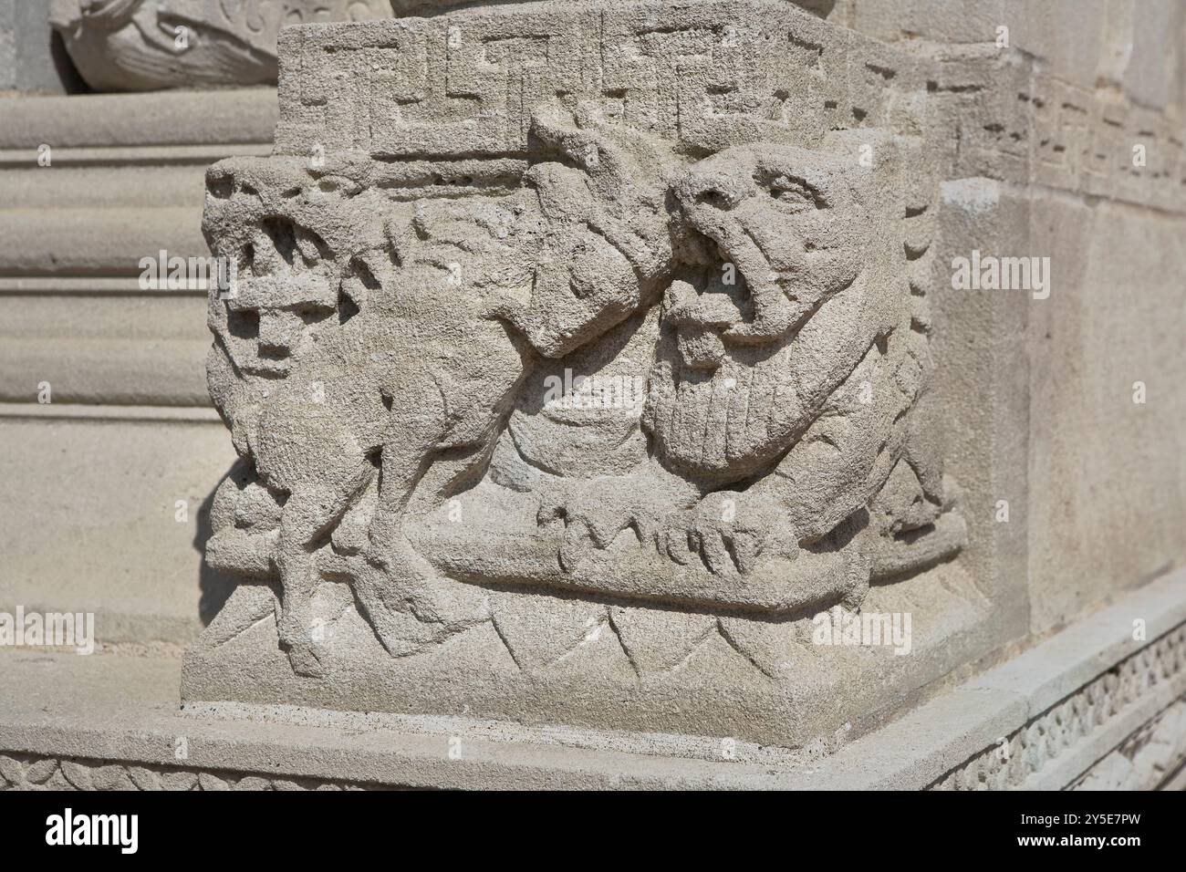 Detail showing carving of beast at base of column on exterior of church ...