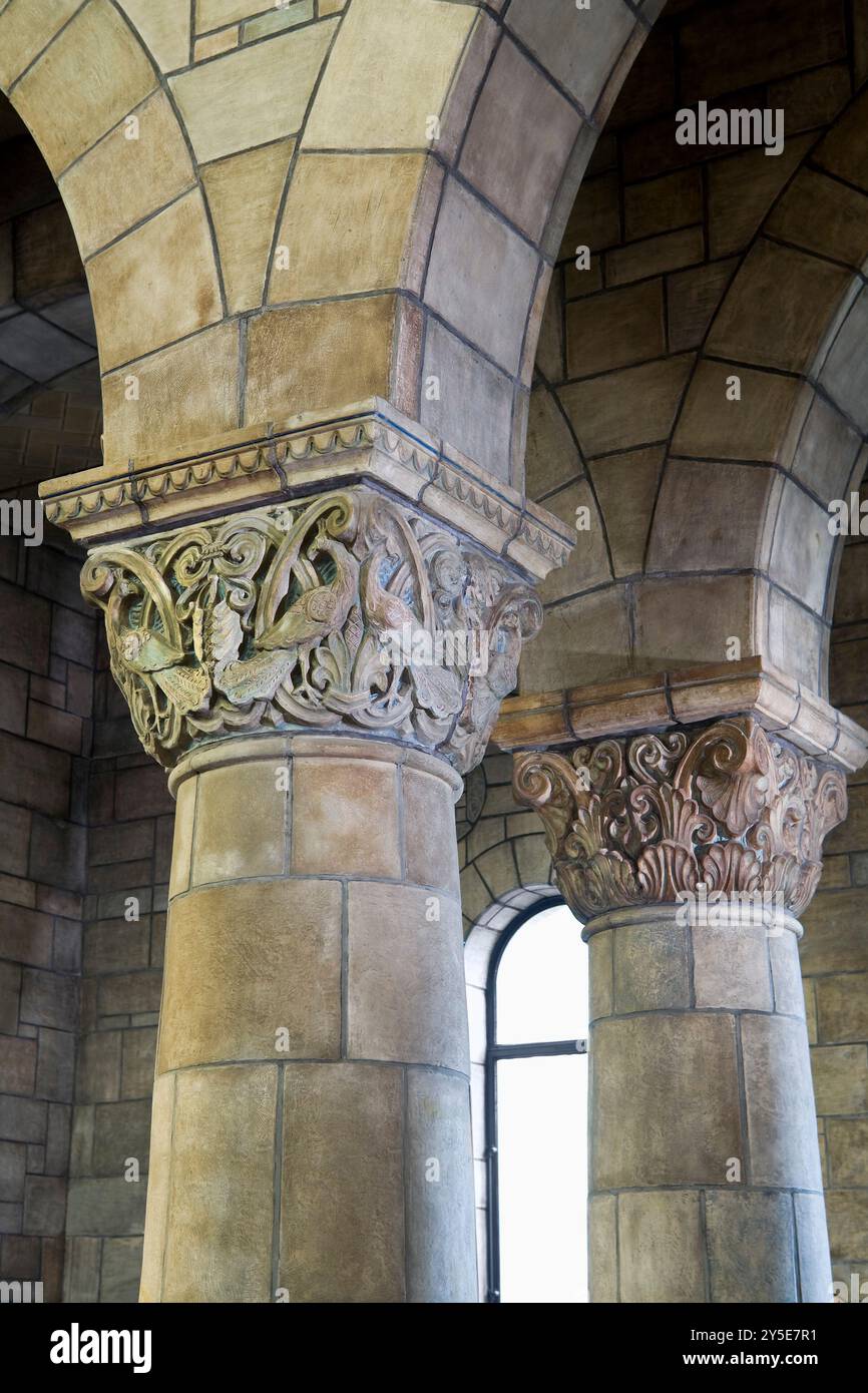 Two columns showing details of capitals in old church Stock Photo - Alamy