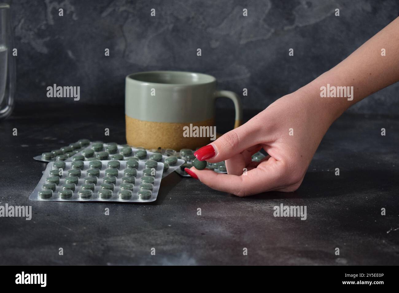 Green algae powder, pills and capsules Stock Photo - Alamy