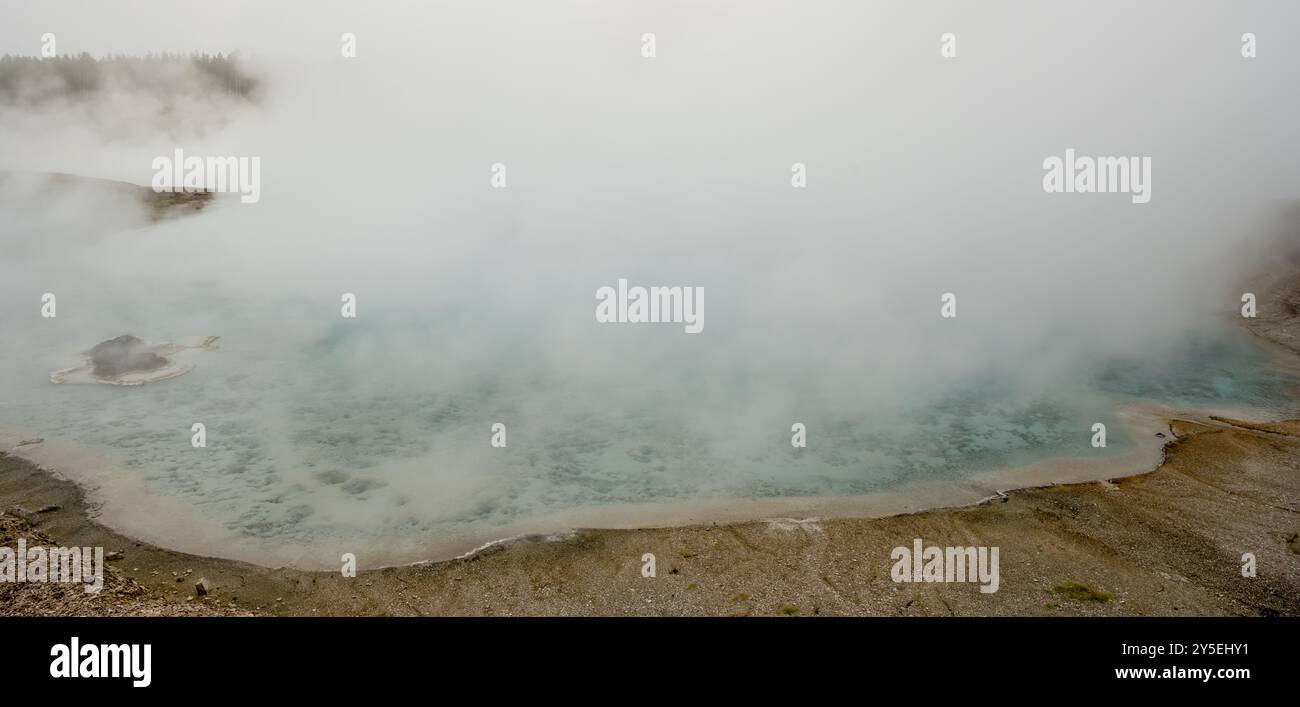 Blue Water Of Thermal Pool With Thick Fog Clinging To The Surface in ...