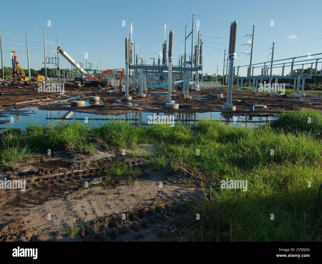 Wide view of the Electric substation under construction. Dirt piles ...