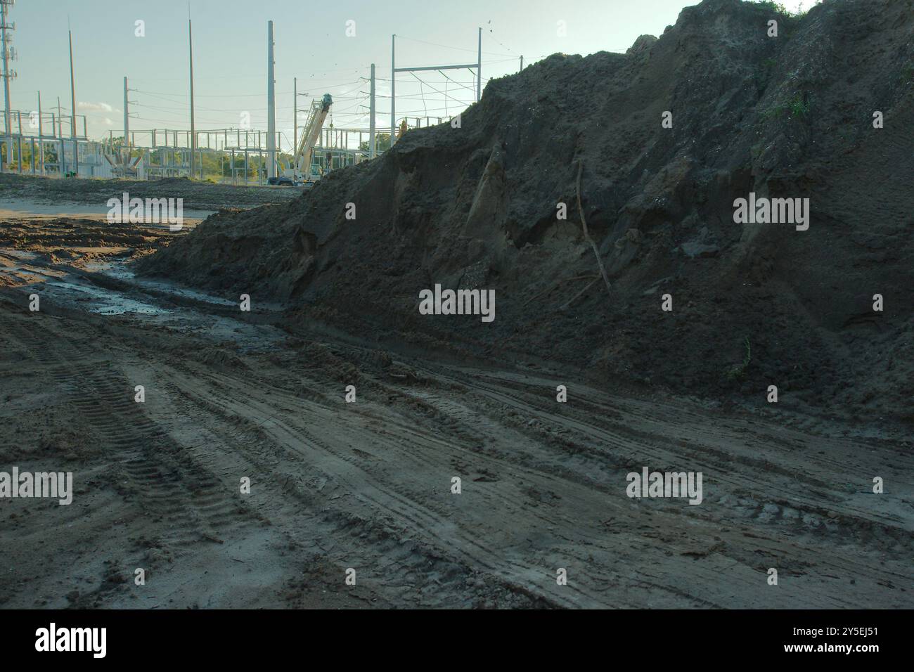 Wide view near dirt piles leading lines tire tracks near sunset large ...