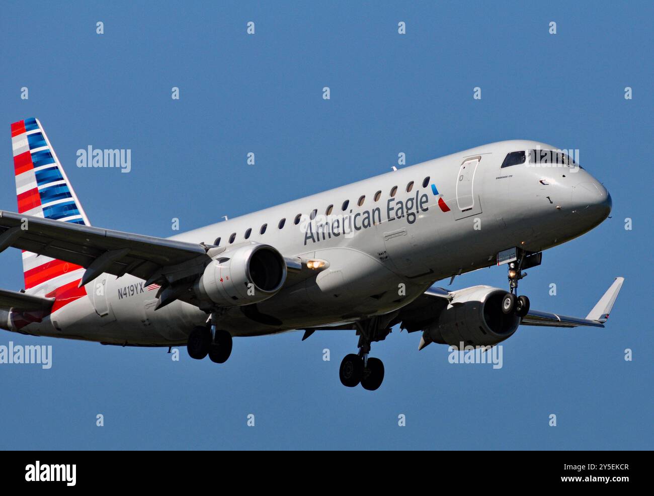 An Embraer E175 aircraft operated by American Eagle prepares to land at ...