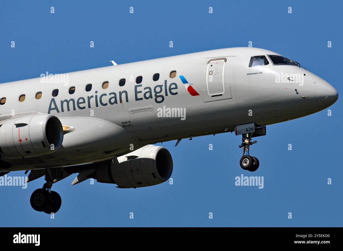 An Embraer E175 aircraft operated by American Eagle prepares to land at ...