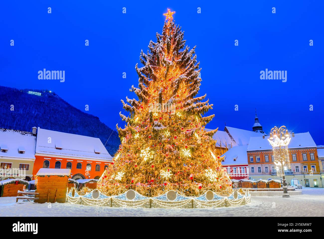 Brasov, Romania. White frozen Christmas Market with Xmas Tree twinkling ...