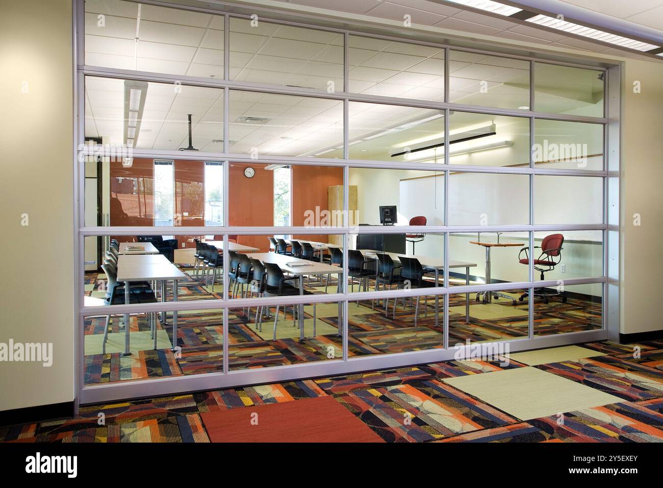 High school classroom seen through large movable window that looks like ...